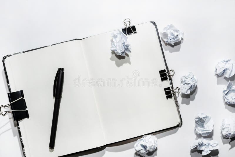 Notepad on a White Background with Scattered Crumpled Notes Stock Photo ...