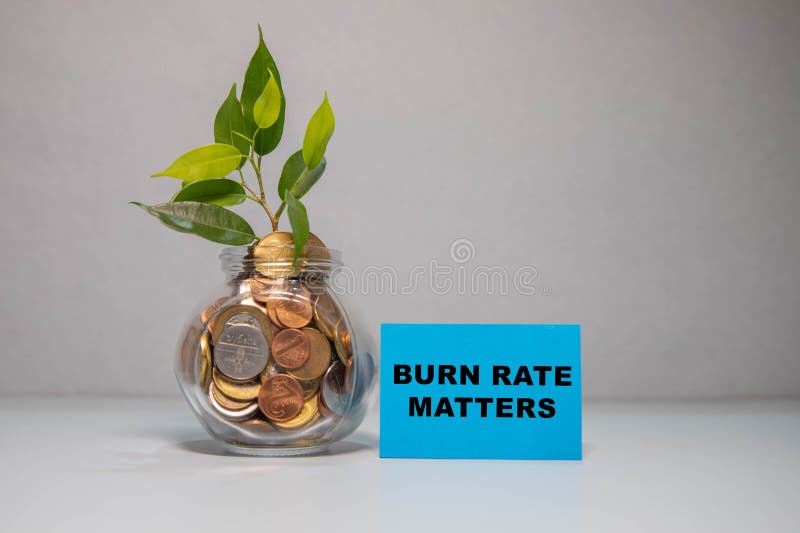Notepad with the Words Burn Rate on a Financial Charts with Red Pen on ...