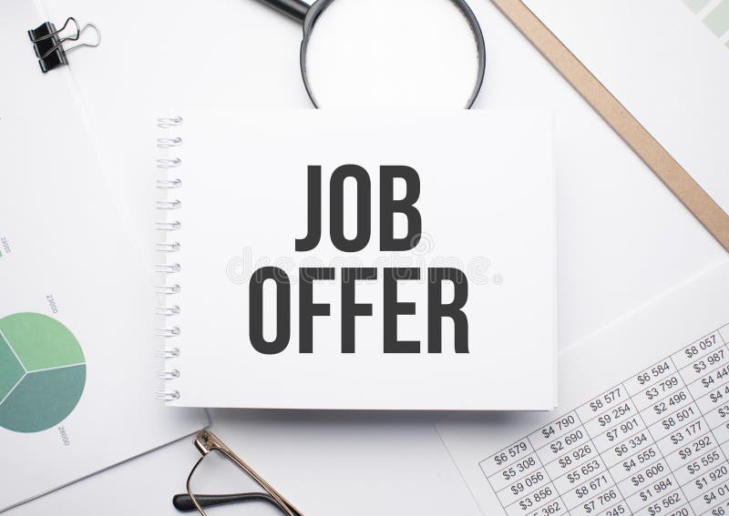 On the Notepad for Writing the Text Job Offer, Magnifier,charts and ...