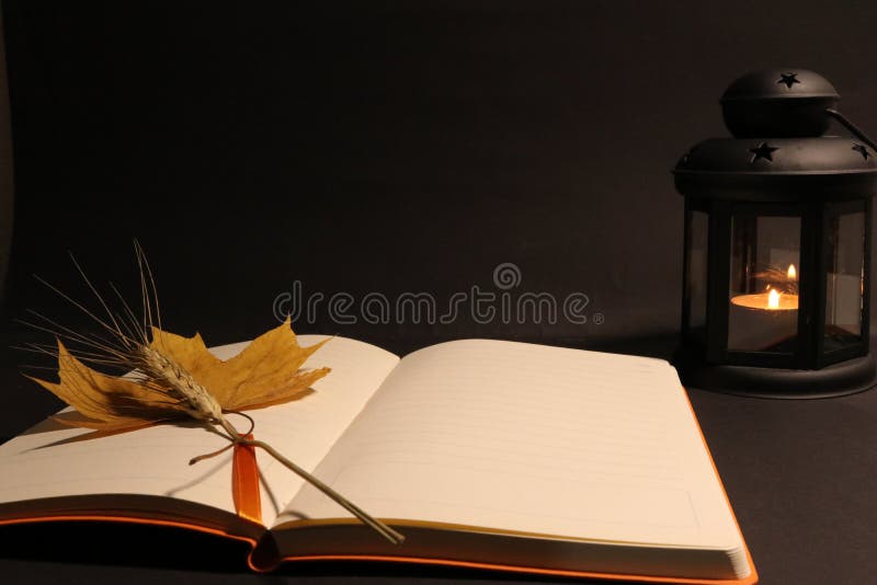 Notepad, Yellow Maple Leaf, Wheat Spike and Candle Isolated on Black ...