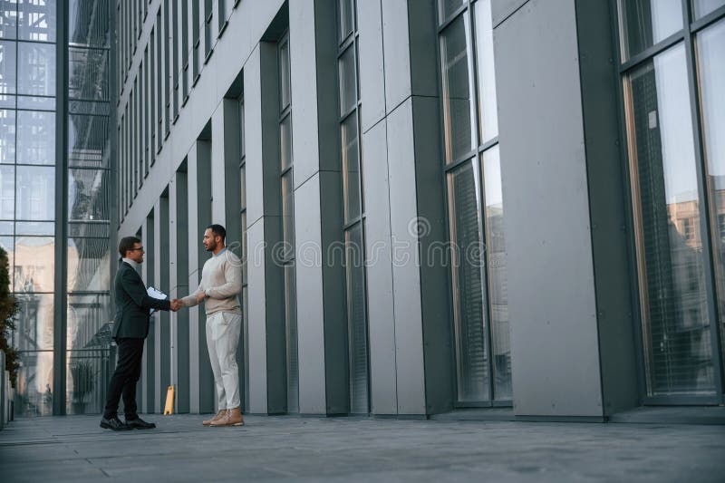 With Notepat and Documents. Businessman in Formal Clothes is with Black ...