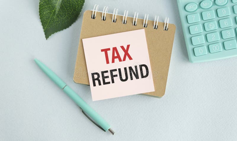 TAX REFUND with the Office Tools on Blue Background . Concept TAX ...