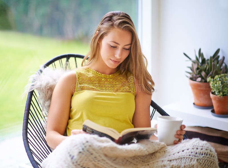 Nothing Beats a Good Book. a Young Woman Reading a Book at Home. Stock ...