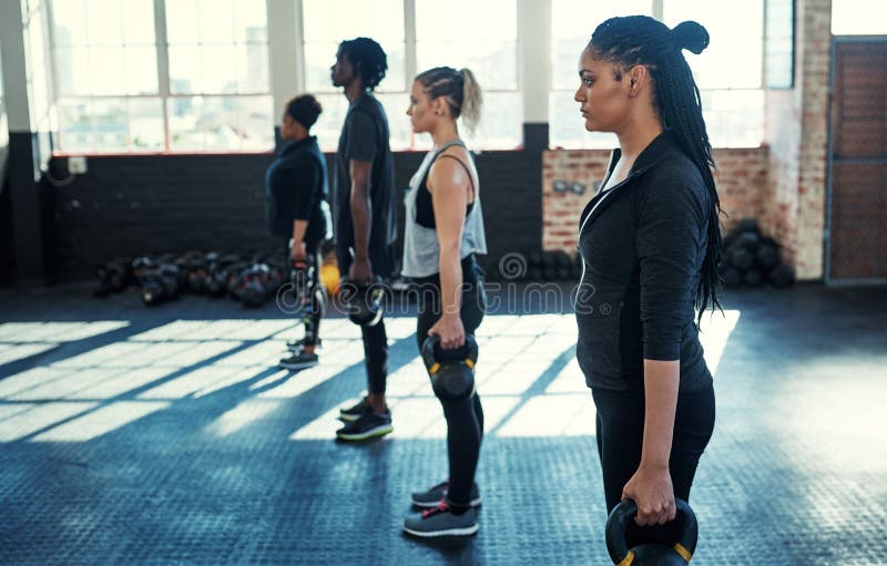 Nothing Can Stop Us. a Focused Group of Young People Standing in a Row ...