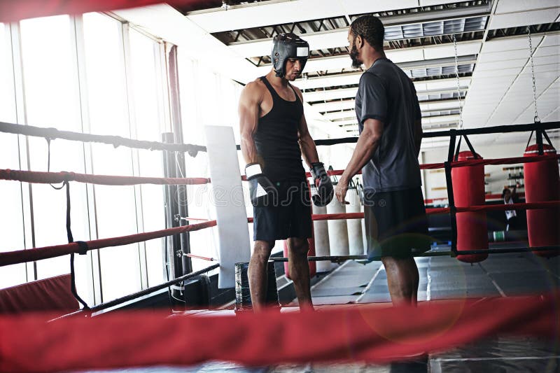 Nothing Makes a Great Boxer Like a Great Coach. a Man Training in the ...