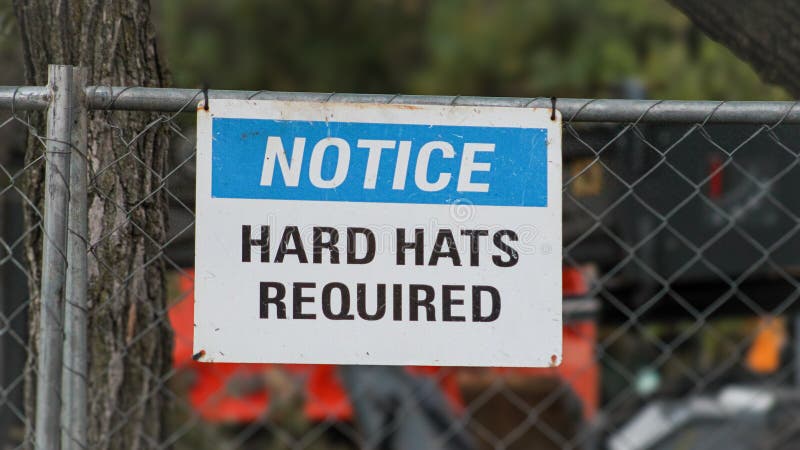 Notice Hard Hat Required Sign on Metal Fence Stock Photo - Image of ...