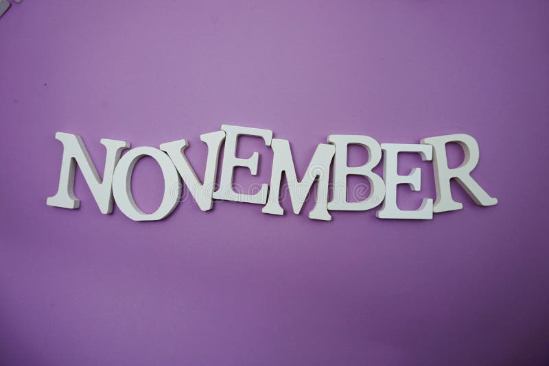 November Alphabet Letter with Space Copy on Purple Background Stock ...