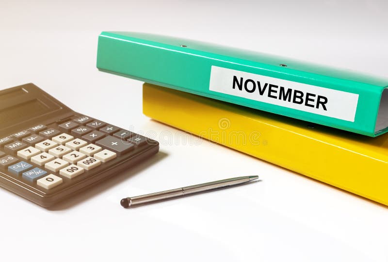 November Concept Inscription on Office Table with Folders and ...