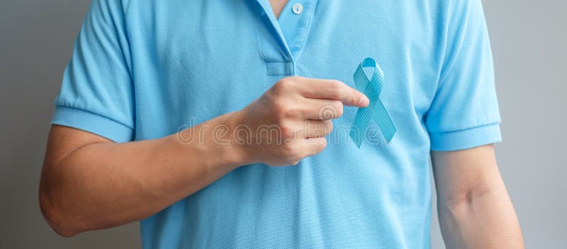 November Prostate Cancer Awareness Month Man In Blue Shirt With Hand