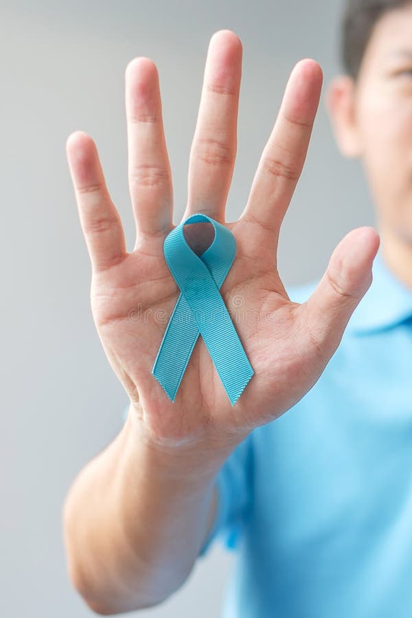 November Prostate Cancer Awareness Month Man In Blue Shirt With Hand