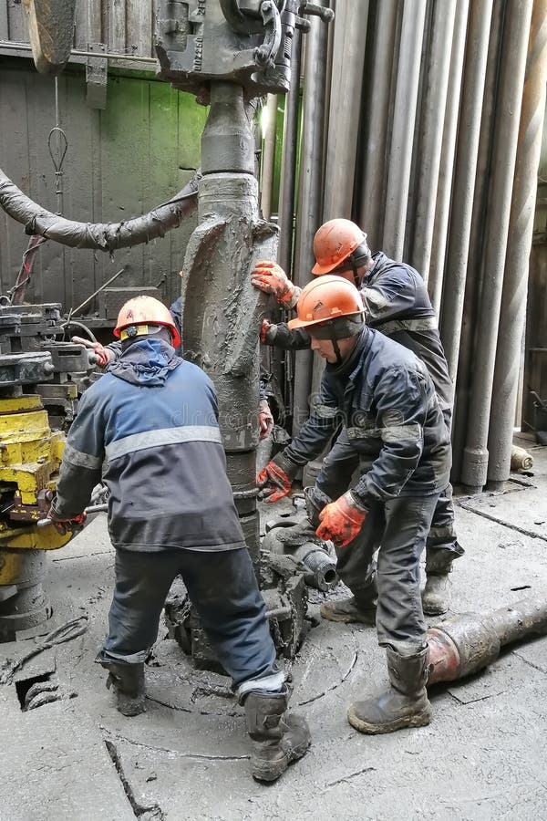 A drilling rig workers stock image. Image of coveralls - 12424021