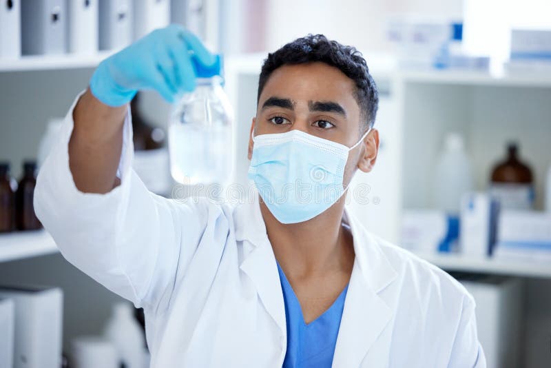 This is Now Ready for Trial. a Young Man Analysing a Sample in a Lab ...