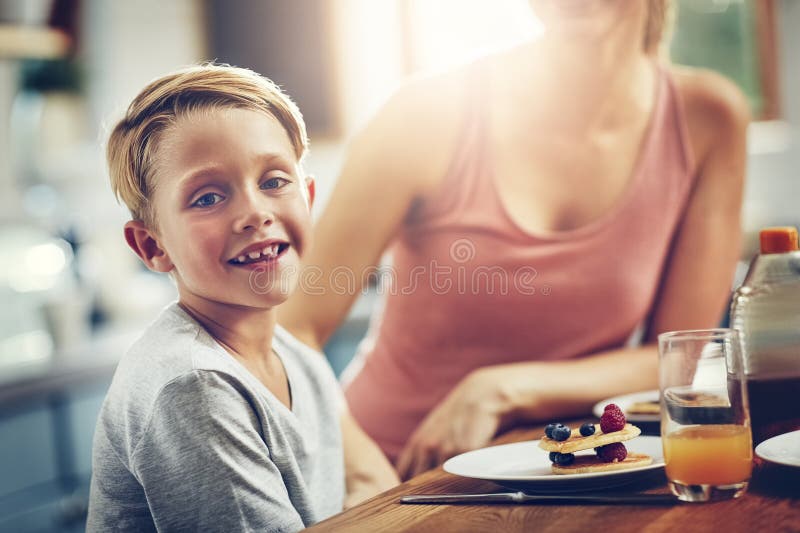 Now Thats His Kinda Breakfast. a Little Boy Having Breakfast at Home ...