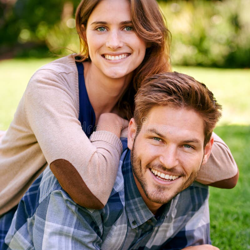 Now Thats True Love. a Loving Couple Lying on the Grass. Stock Photo - Image of brunette ...