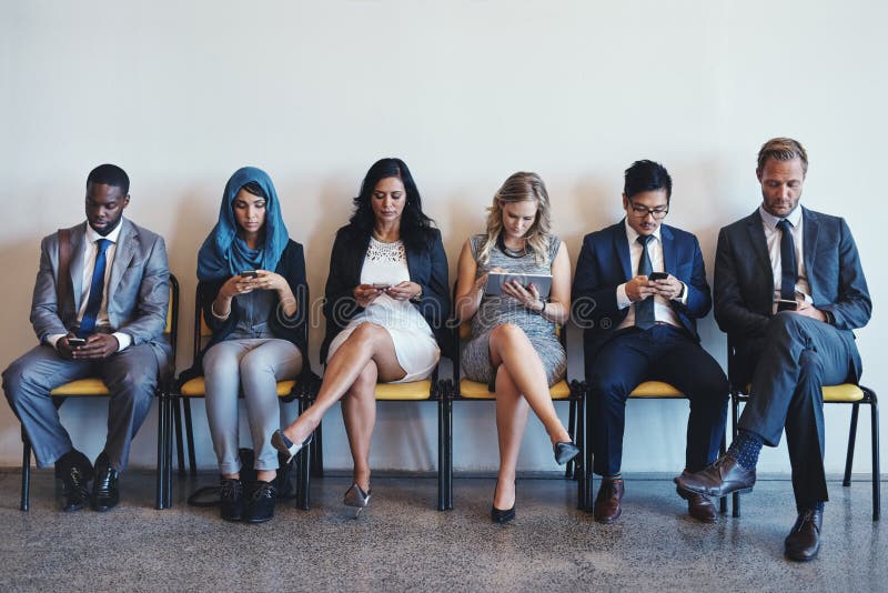 And Now for the Waiting Game. a Group of Confident Businesspeople ...