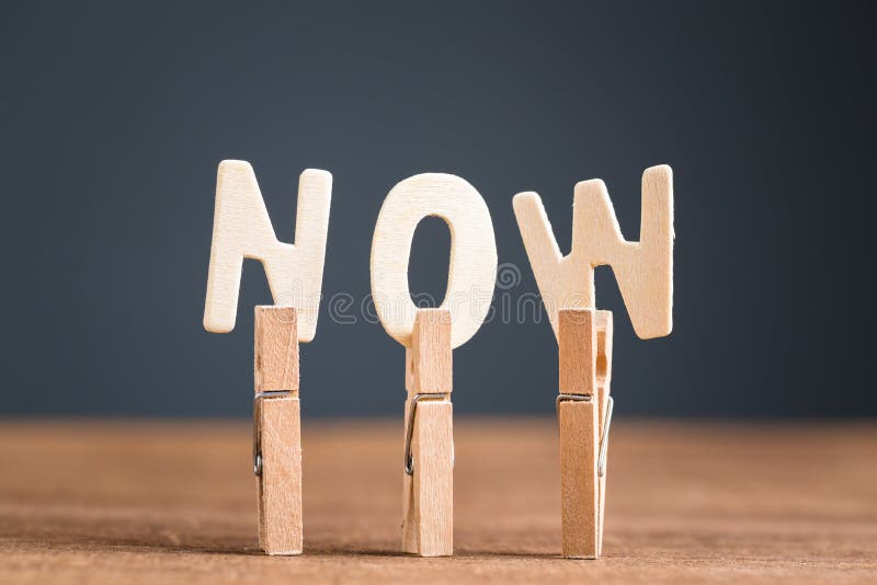 NOW Word on Clothespin stock image. Image of change - 193330391