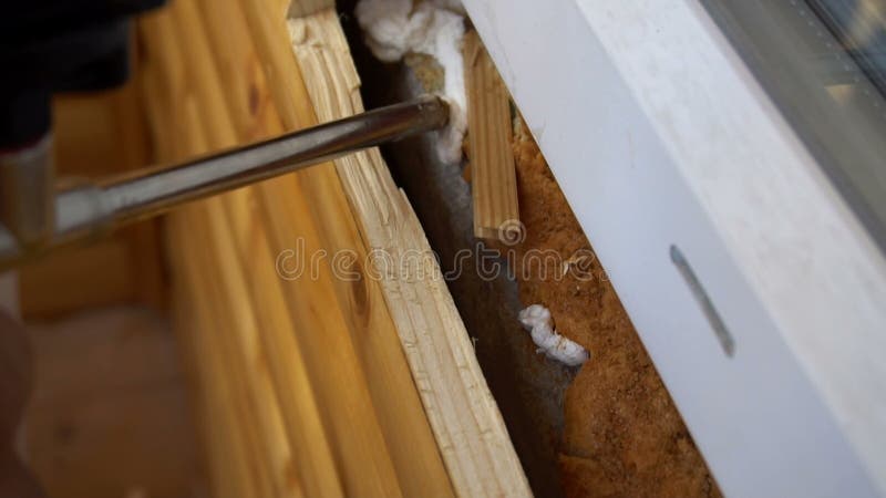 Nozzle of Construction Gun Fills Space Under Window Frame by ...