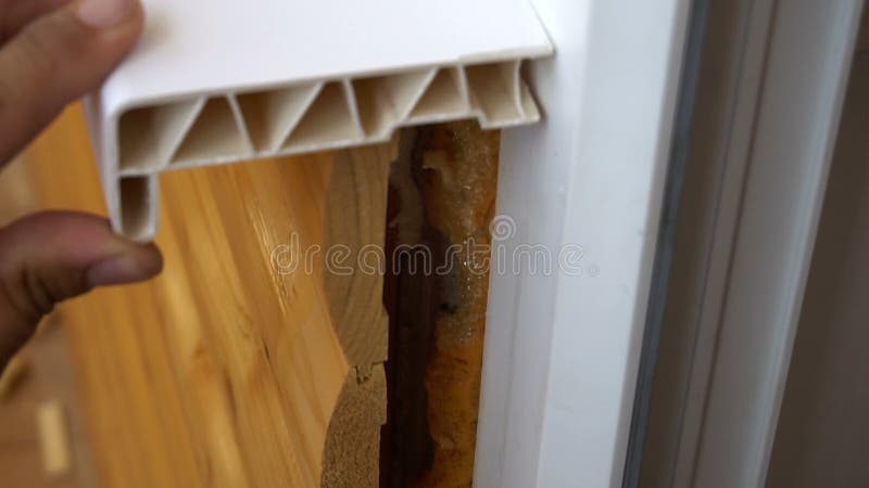 Nozzle of Construction Gun Fills Space Under Window Frame by ...
