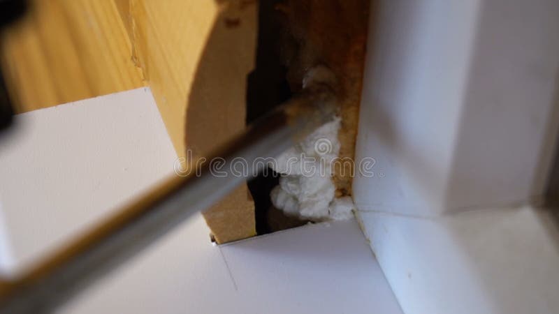 Nozzle of Construction Gun Fills Space Under Window Frame by ...