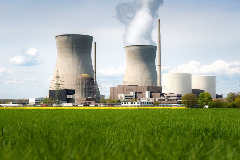 Nuclear Power Plant with Yellow Field and Big Blue Clouds Stock Image ...