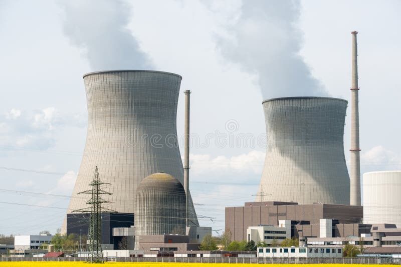 Nuclear Power Plant with Yellow Field and Big Blue Clouds Stock Image ...