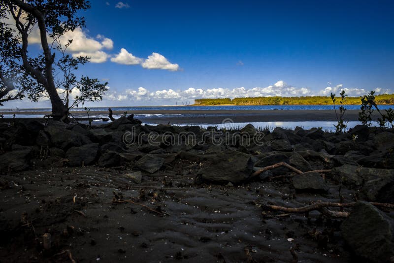 Nudgee beach view stock photo. Image of bright, sand - 112718964