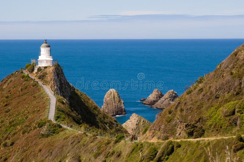 Nugget Point lighthouse stock image. Image of coast, path - 16498275