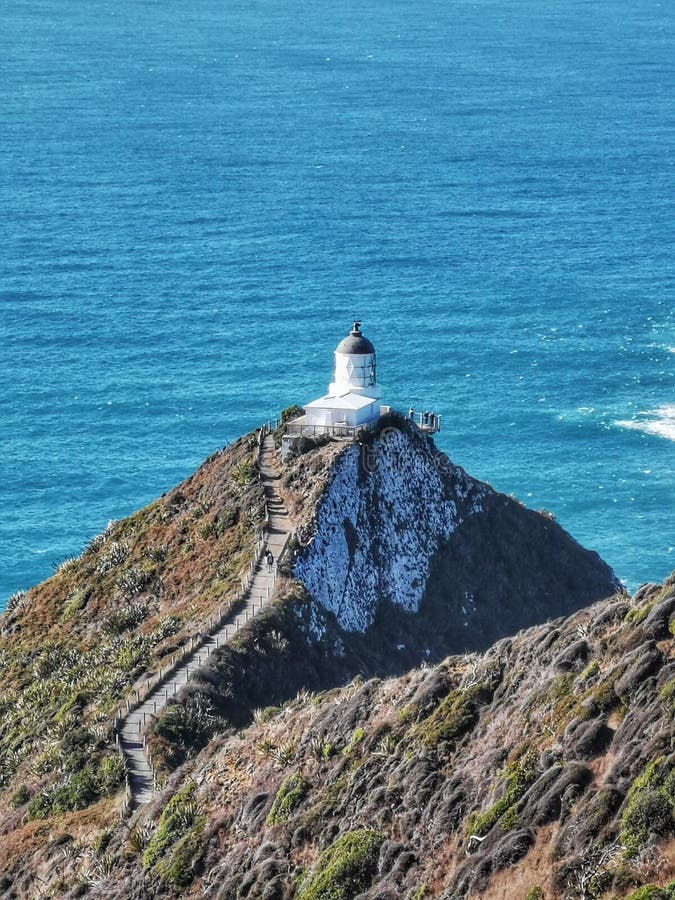 Nugget Point Lighthouse with Blue Pacific Ocean Waters on the ...