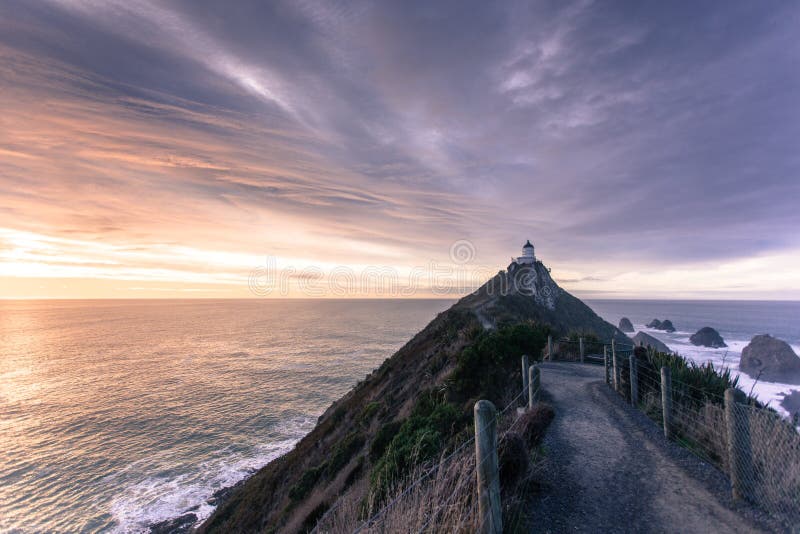Nugget Point Lighthouse in New Zealand Stock Photo - Image of mood ...