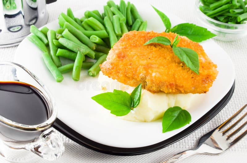 Nuggets of Chicken, Mashed Potatoes and Herbs Stock Photo - Image of ...