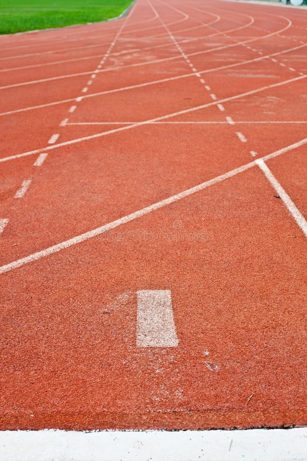 Running Lane with Grass Field Stock Image - Image of flag, light: 26266047