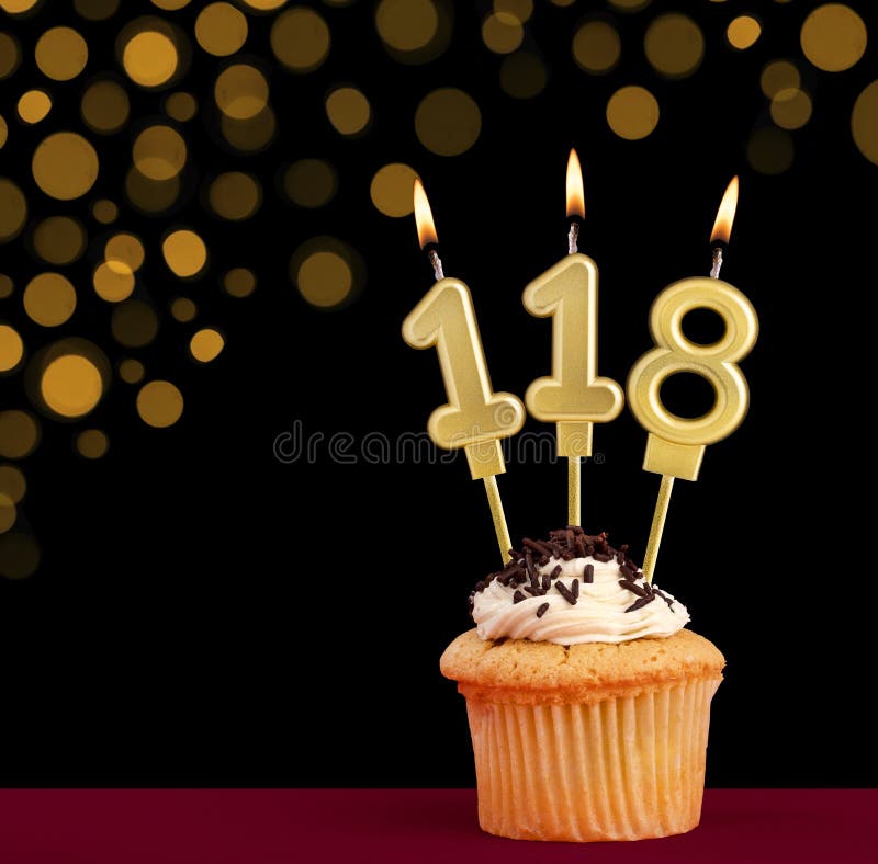 Number 118 Birthday Candle - Cupcake on Black Background with Out of ...