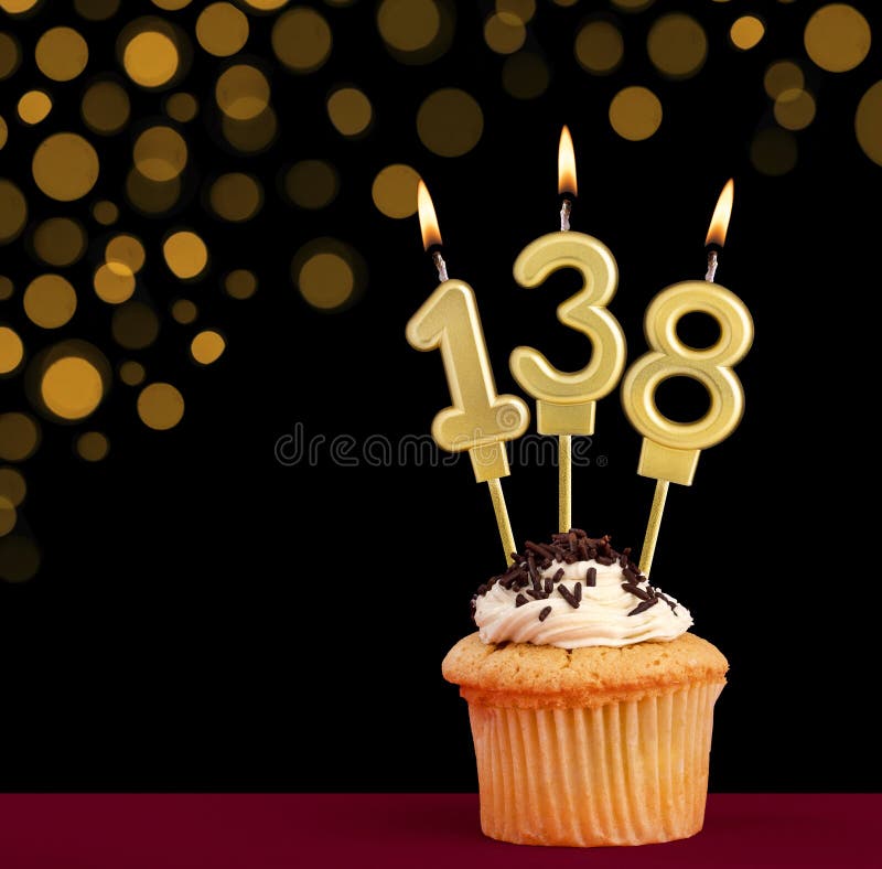 Number 138 Birthday Candle - Cupcake on Black Background with Out of ...