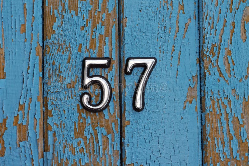 Number 57 on Blue Wooden Wall with Peeling Paint Stock Photo - Image of ...