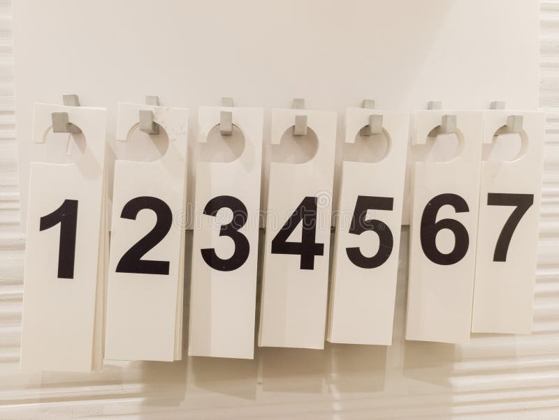 A Number Board with Numbers Hanging on a Wall Stock Image - Image of ...