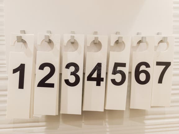 A Number Board with Numbers Hanging on a Wall Stock Image - Image of ...