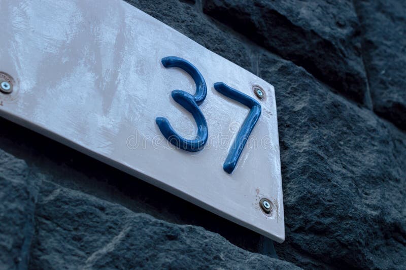 Number 37 Building White Ceramic Number Plate with Blue Numbers, on the ...