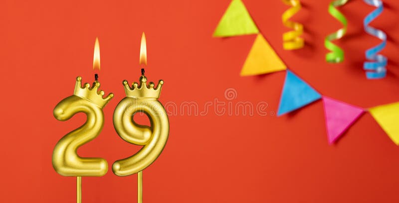 Number 29 Candle - Birthday Celebration on an Orange Background with ...