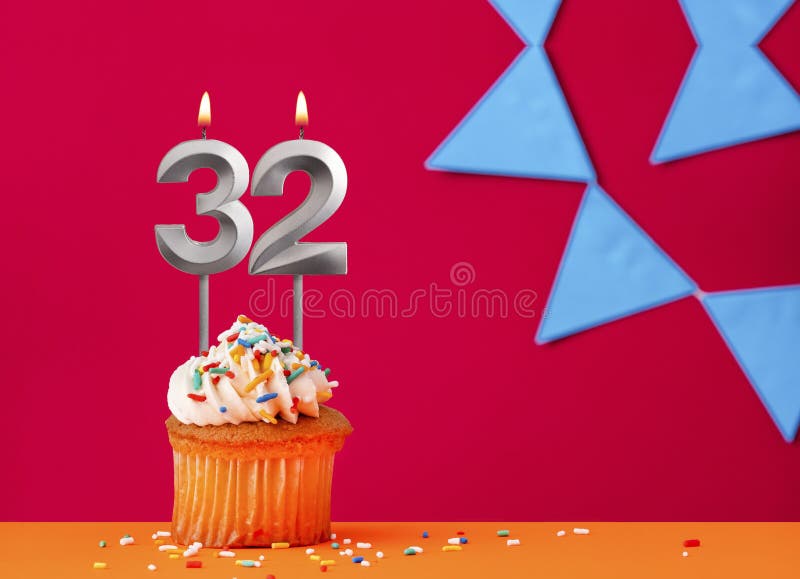 Number 32 Candle with Birthday Cupcake on a Red Background with Blue ...