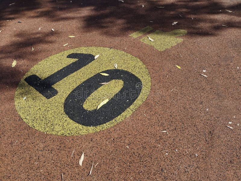Number 10 on Colorful Playground Surface with Shadows and Leaves Stock ...