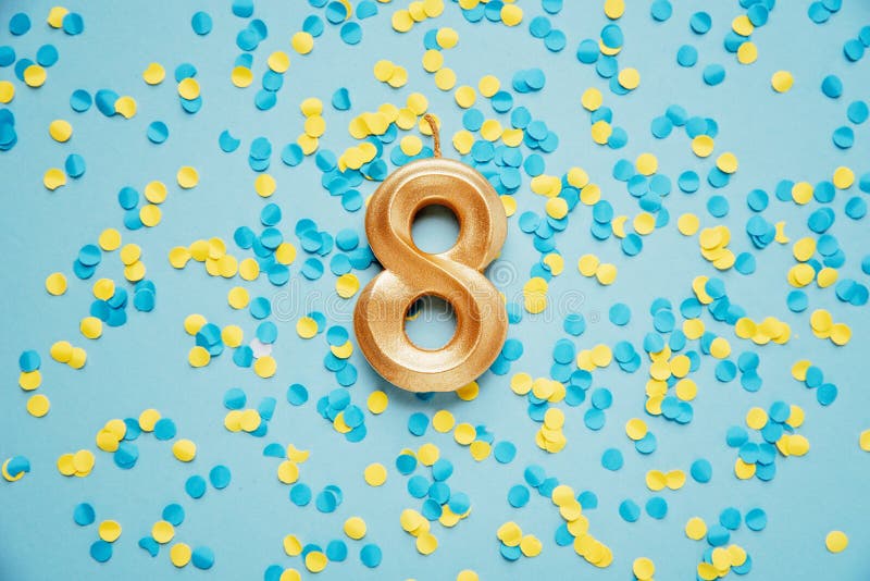Number 8 Eight Golden Celebration Birthday Candle On Yellow And Blue