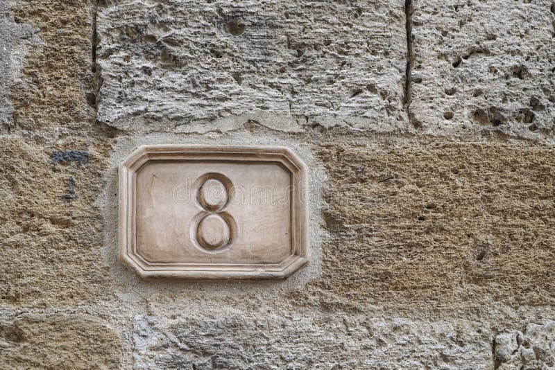 Number eight on a wall stock photo. Image of numeric - 109692844