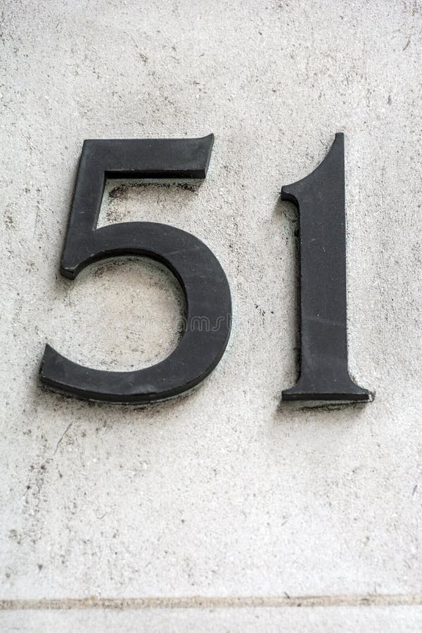 Number Fifty One in Dark Figures on White Wall Stock Image - Image of ...