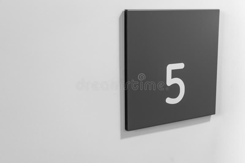 Number Five 5 Sign on Blacn Plastic on White Wall Stock Image - Image ...