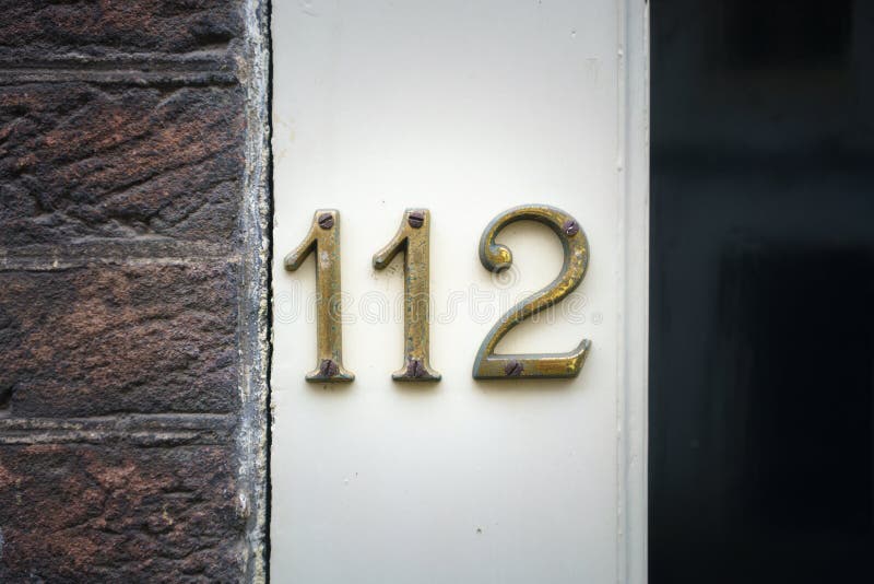 House number 112 stock photo. Image of bronze, numerals - 141233702