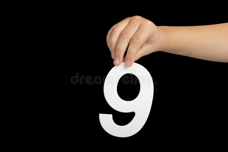 Number Nine in Hand Isolated on Black Background. Number 9 in a Child S ...