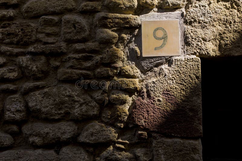 Number Nine Shining on a Rock Wall Stock Photo - Image of painted ...