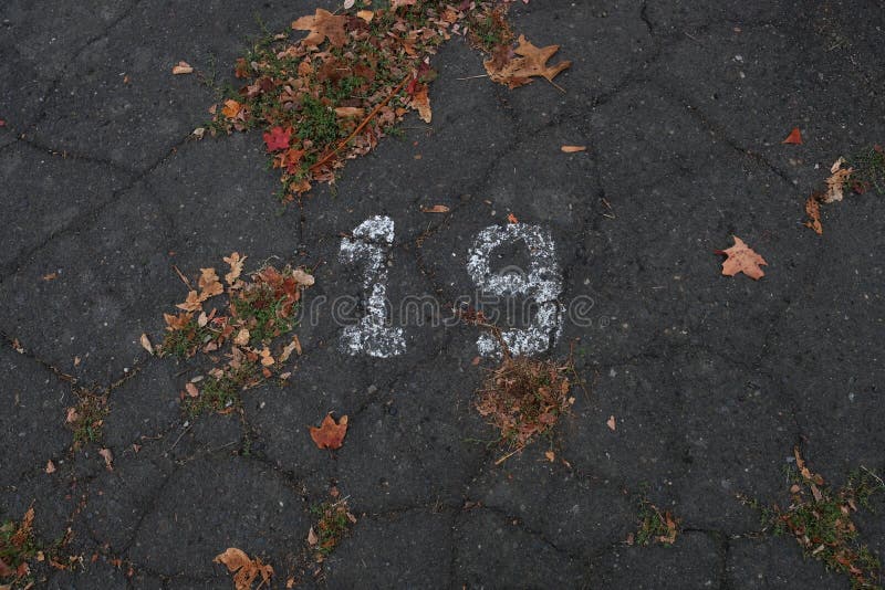 Number Nineteen 19 on the Street in White Paint Stock Image - Image of ...