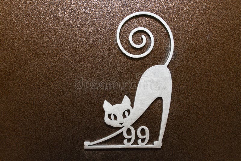 Number Ninety-nine and a Cat on the Metal Front Door Stock Image ...