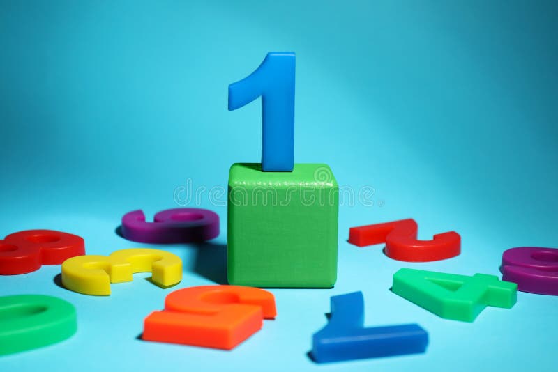 Number One among Fallen Magnets on Light Blue Background Stock Photo ...